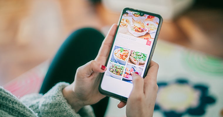 Woman using meal delivery service through mobile app. | Gordon Food Service